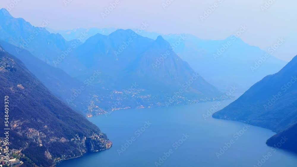 Hazy Monte dei Pizzoni topped with Sasso di Cressogno, Valsolda, Italy ...