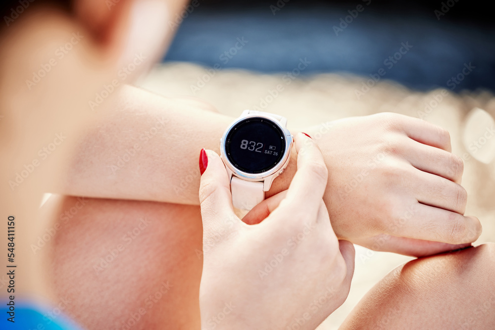 Watch, time and exercise with a sports woman tracking her workout ...