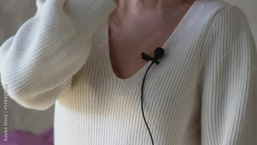 without a face. Lapel microphone on clothing during video recording ...