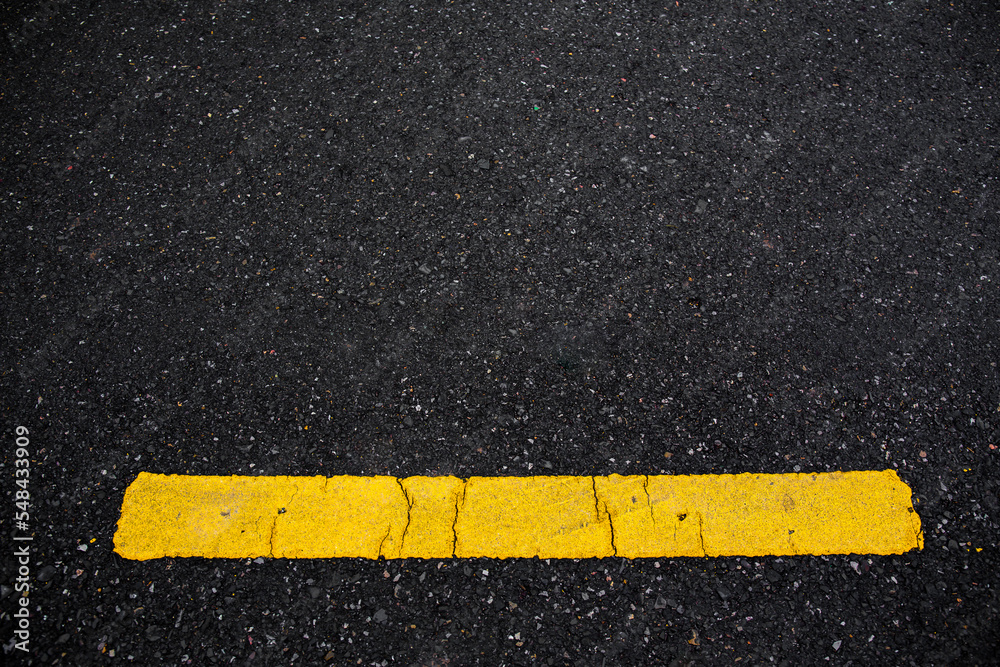 abstract Asphalt road surface with yellow line. texture for add text ...