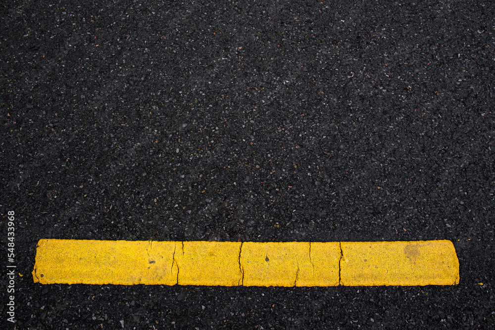 abstract Asphalt road surface with yellow line. texture for add text ...