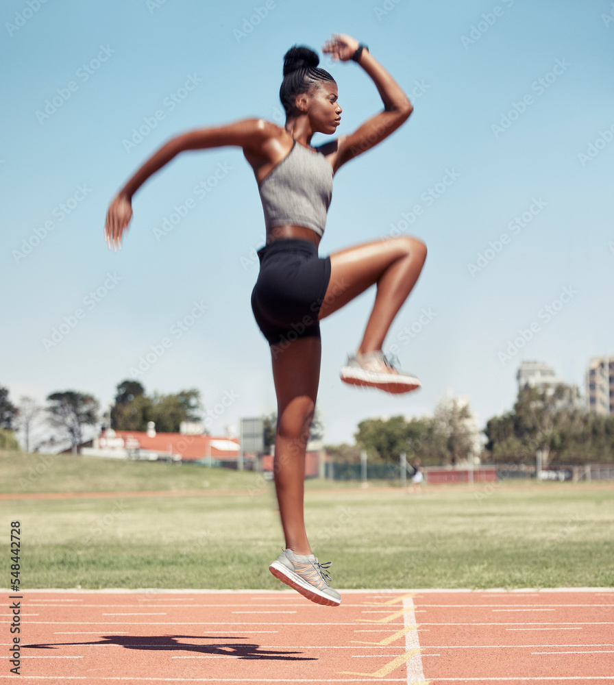 Fitness, jump or black woman runner on a race track in training, cardio ...