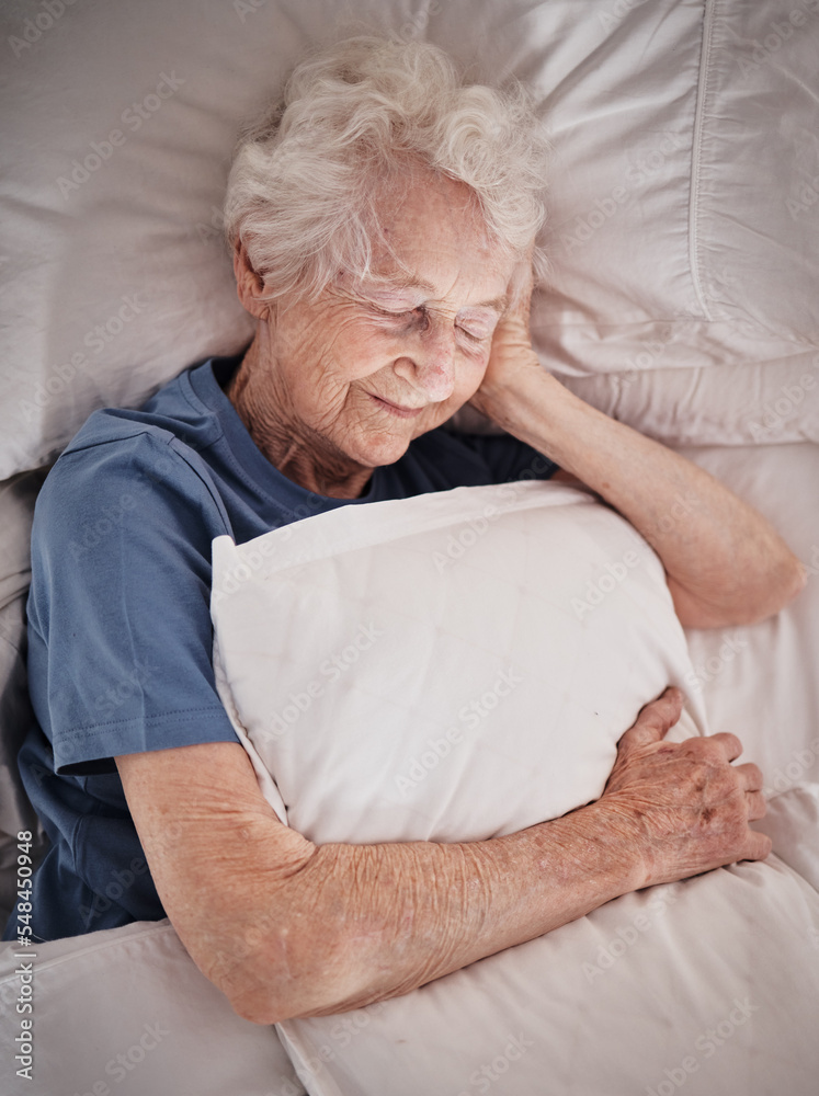 Relax, bedroom and old woman sleeping in peace resting in a house or ...