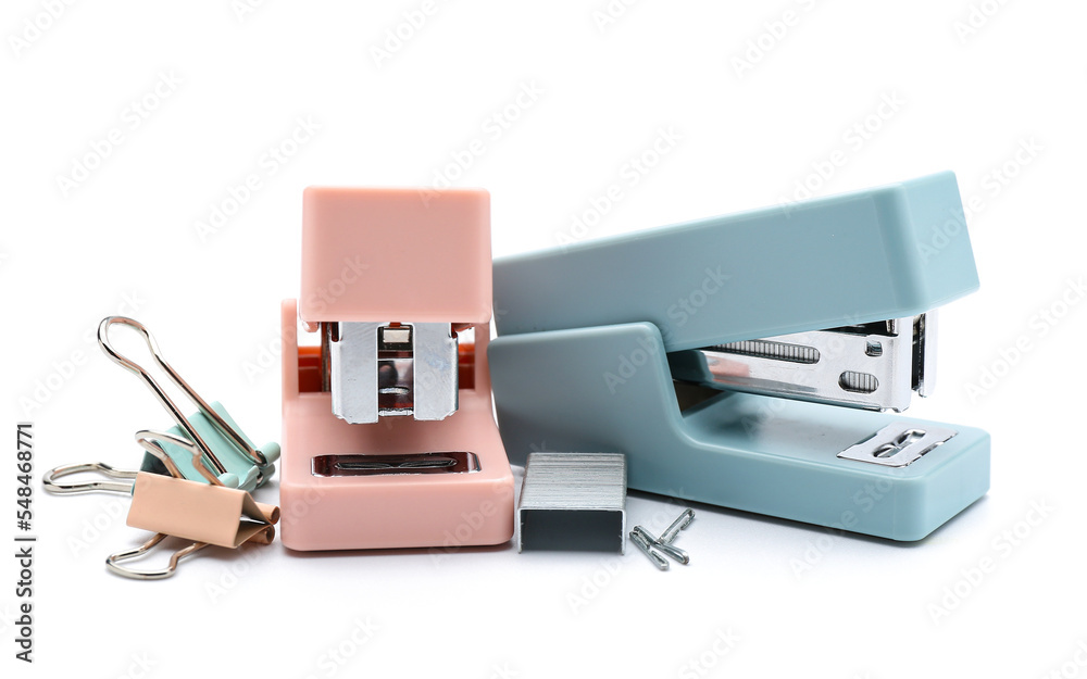 Office staplers, staples and paper clips on white background Stock ...