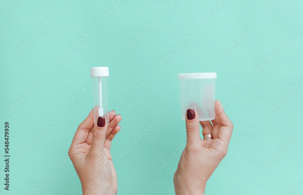 Female hands with empty test tubes for analysis. Empty plastic jar for ...
