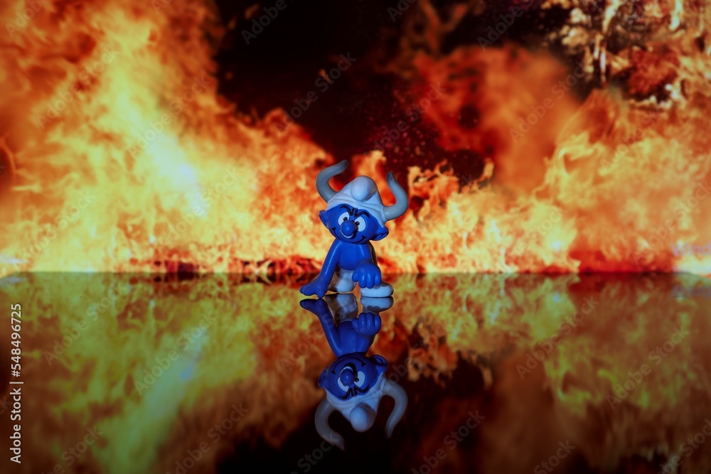 Smurf of Taurus zodiac sign in the background of fire flames Stock ...