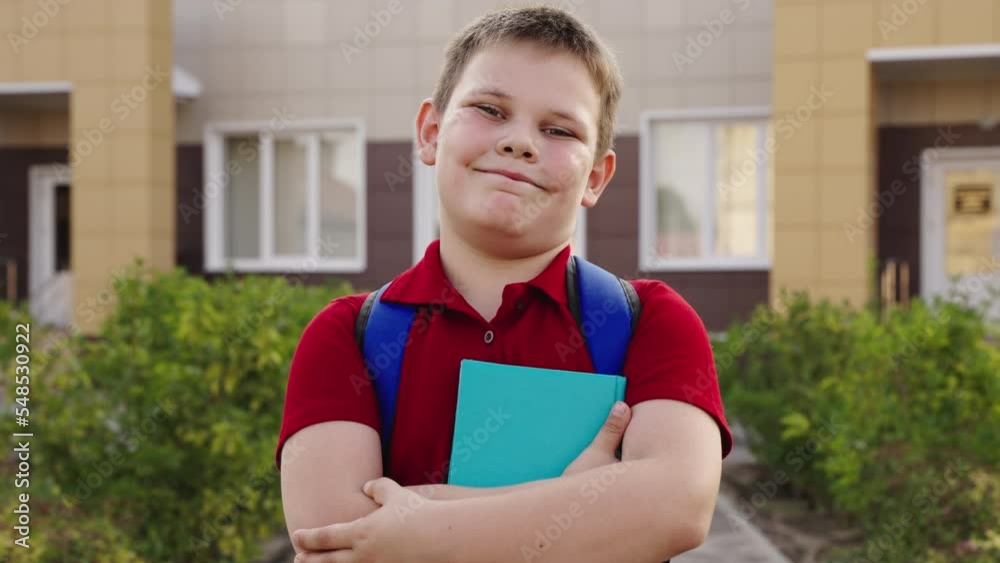 boy book his hands smiles background school. student with textbook ...
