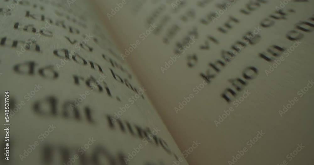 Fast moving macro shot viewed text inside book. Book sheets close-up ...