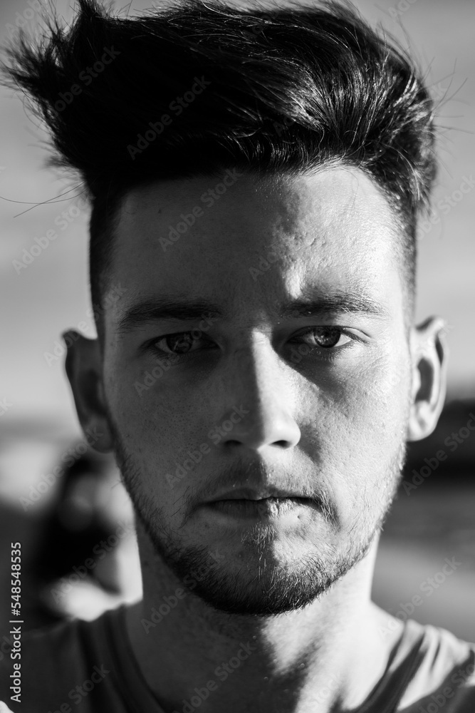 Grayscale portrait of a Caucasian male face by lighting with blur ...