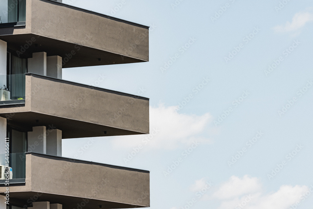 Side of a commercial building balconies. Exterior of a structure with ...