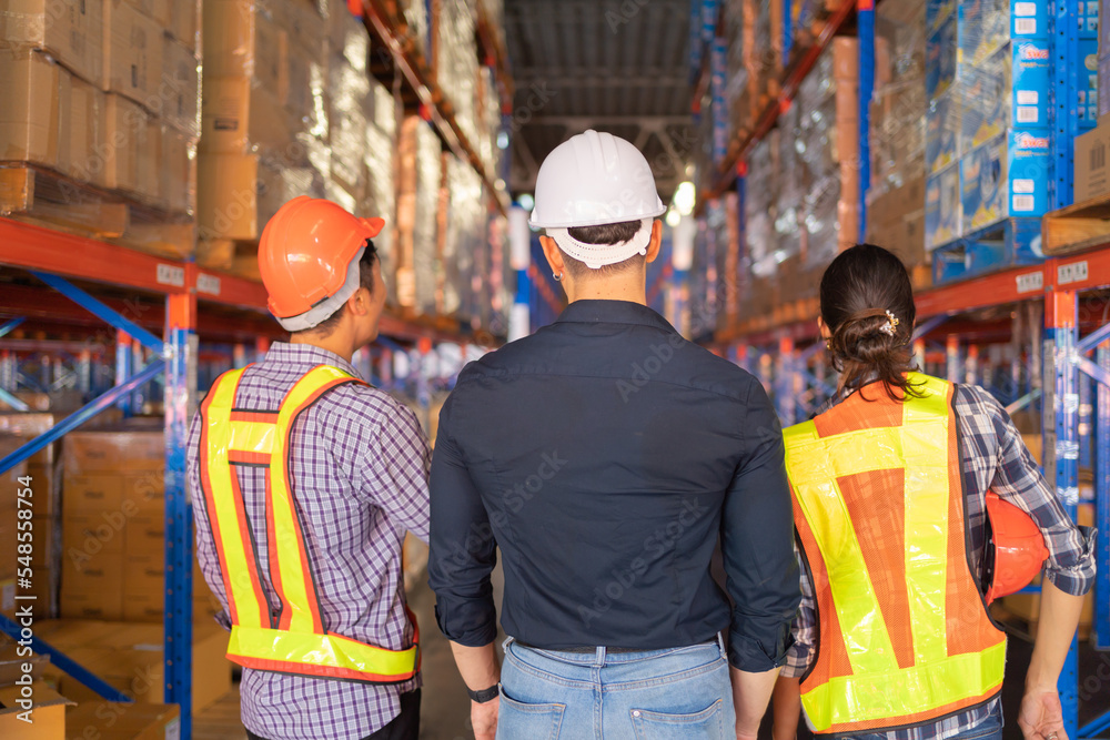 Teamwork of workers working in large warehouse retail store industry ...