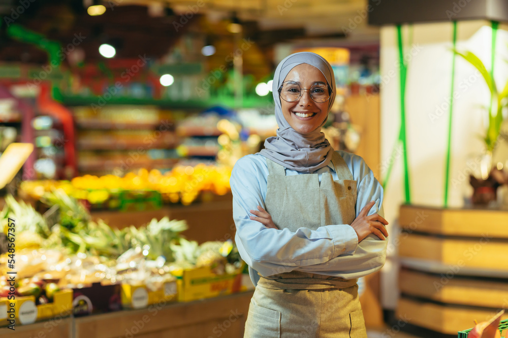 Portrait woman in a hijab as a seller in a supermarket store, a ...