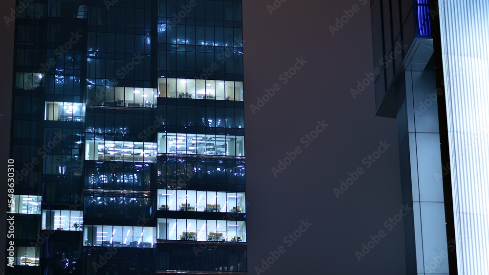 Modern office building in city at the night. View on illuminated ...