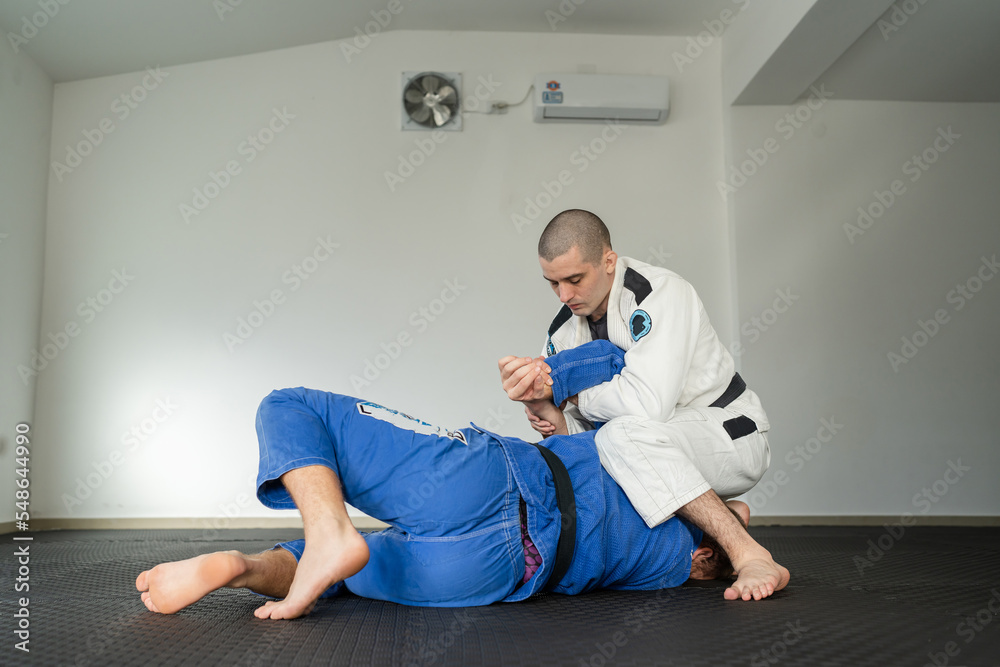 Brazilian jiu jitsu armbar kimura submission arm lock BJJ Stock Photo ... Brazilian jiu jitsu armbar kimura submission arm lock BJJ Stock Photo ...