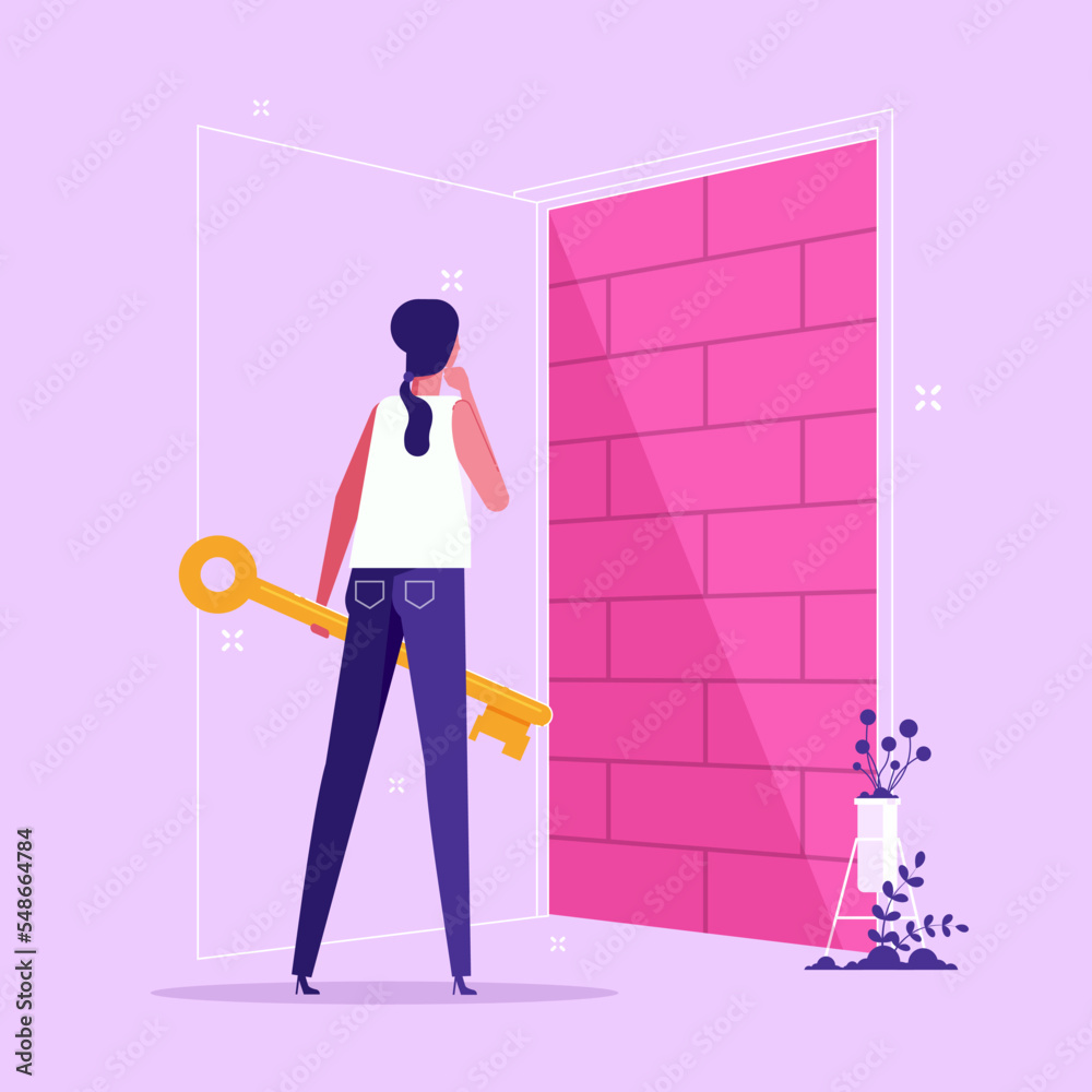 Woman standing in front of open entrance door blocked by brick wall ...