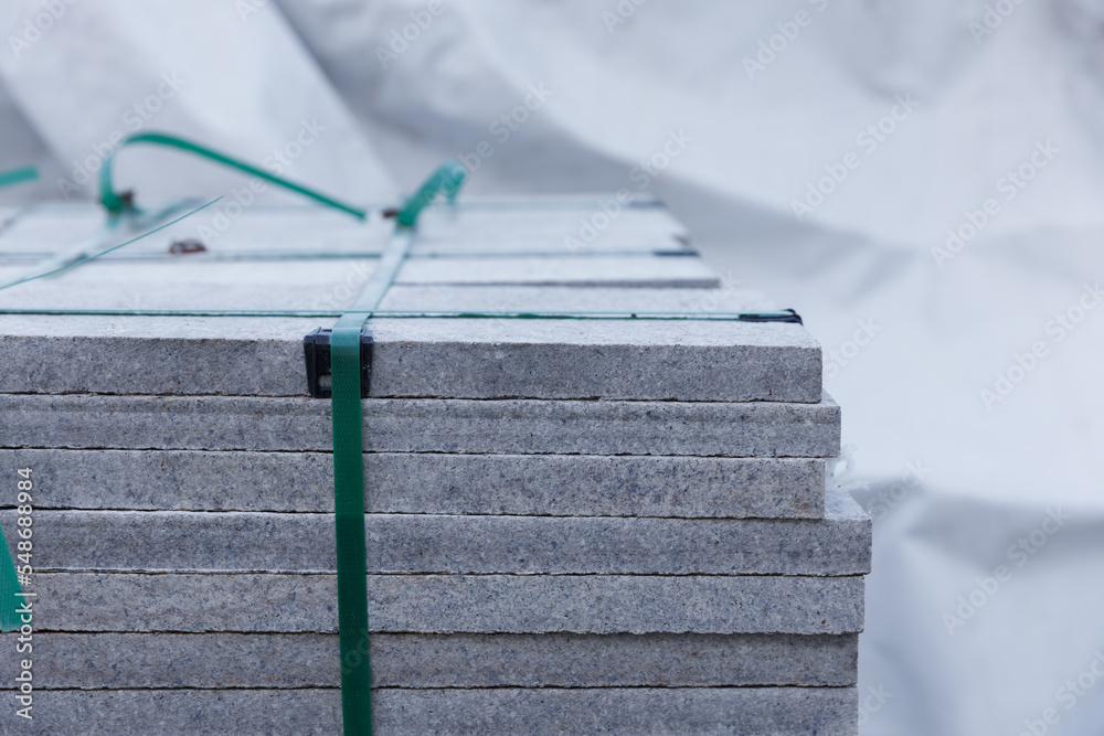 Paving tiles for paving sidewalks. Pallets and packages of fresh ...