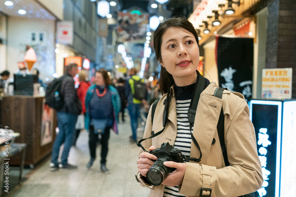 happy asian Japanese woman photographer carrying camera and looking ...