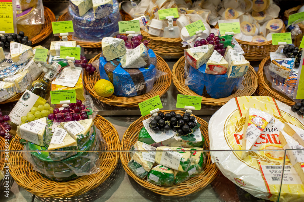 A large selection of cheeses with different types, textures and flavors ...
