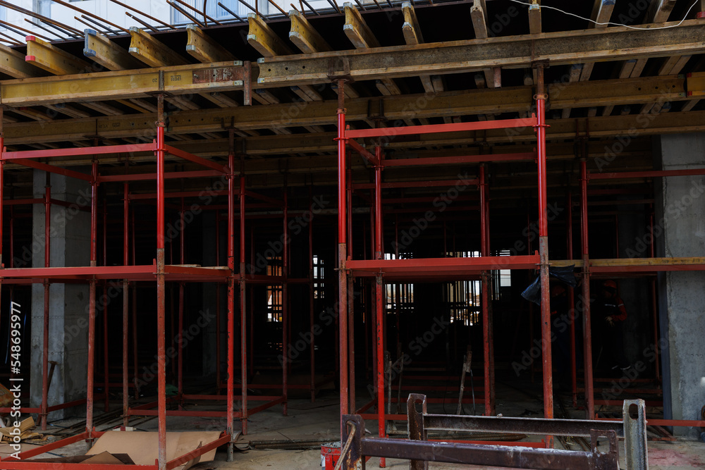 Props supporting the formwork of a floor slab in construction site ...