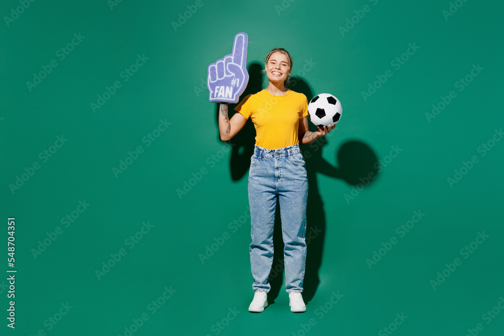 Full body young woman fan wear basic yellow t-shirt foam 1 glove finger ...