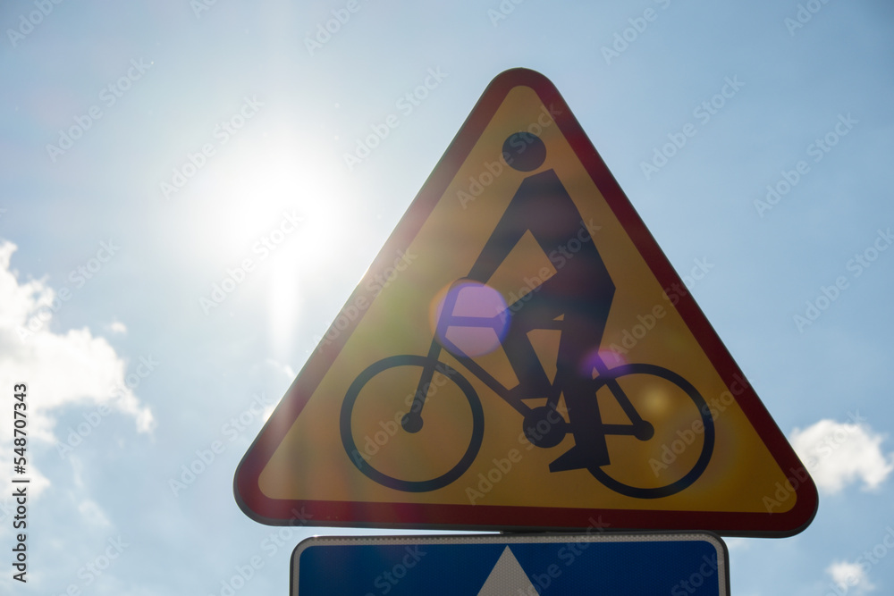 Triangle bicycle sign transit prohibited for bicycles on blurred park ...