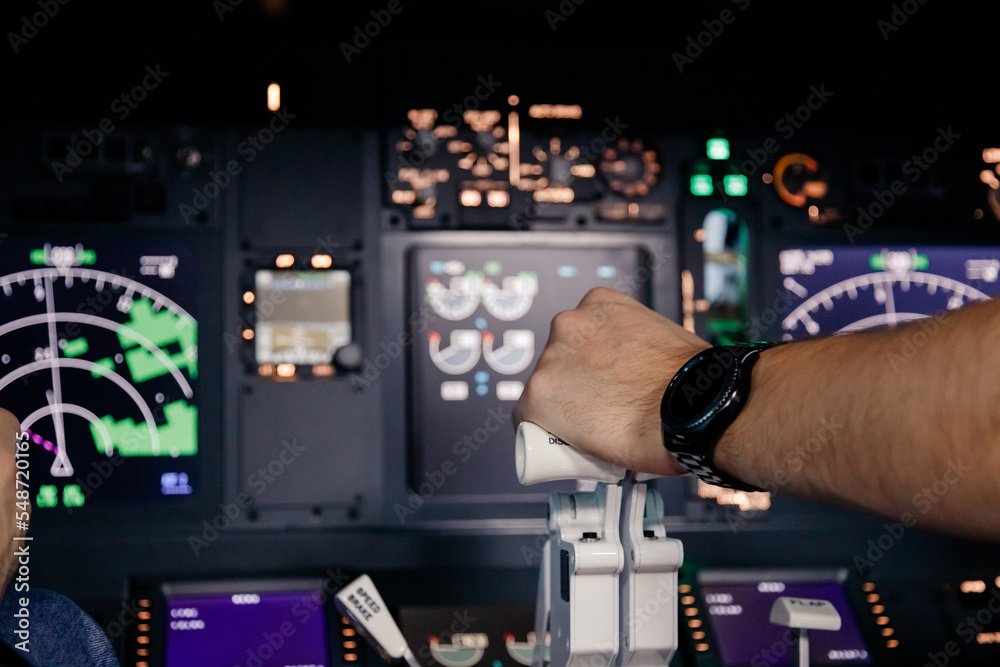 Aircraft captain in cockpit command taking off with airplane ...