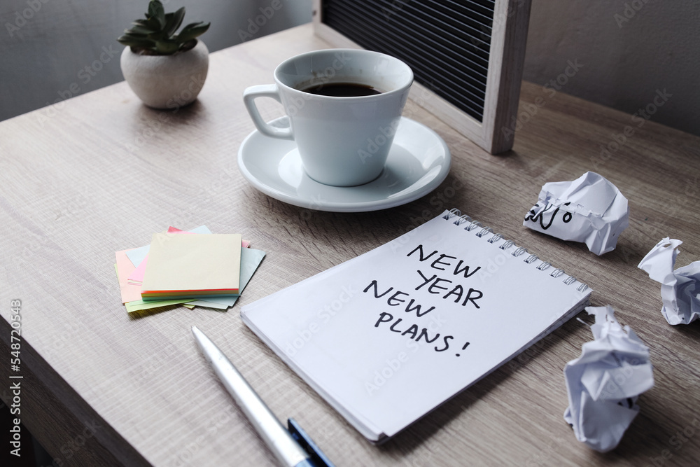 New Year motivational quotes with crumpled paper and coffee Stock Photo ...