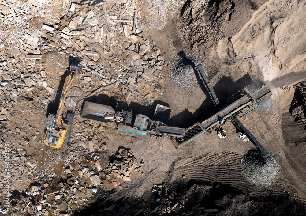 Concrete Recycling and asphalt from demolition. Excavator at landfill ...