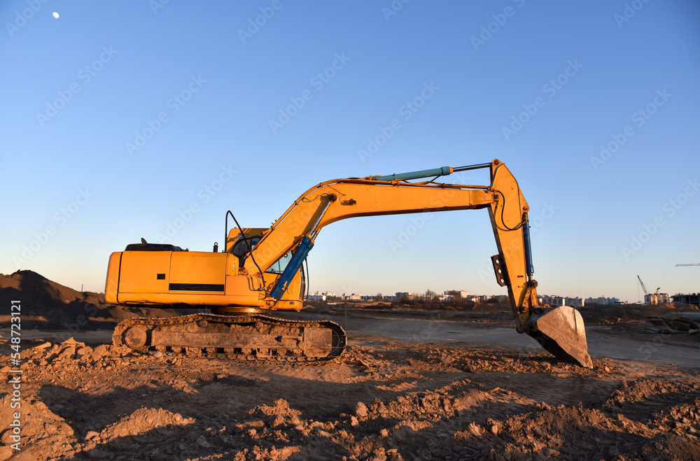 Excavator in open pit mining. Excavator on earthmoving on sunset ...