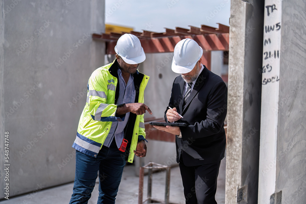 At construction site manager meet senior civil engineer check project ...