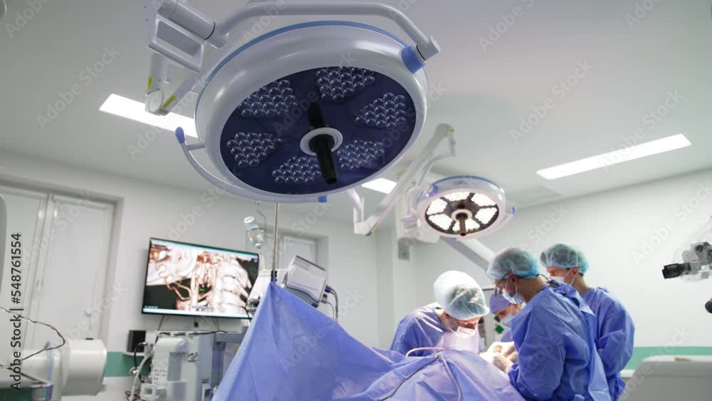 Modern surgery room with two big round lamps on the ceiling. Group of ...
