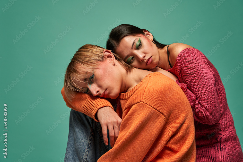 Genderqueer models leaning on each other Stock Photo | Adobe Stock