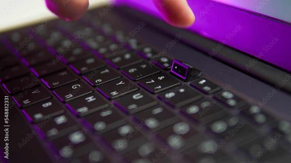 a finger closes the webcam. Recessed camera in front of blurred ...