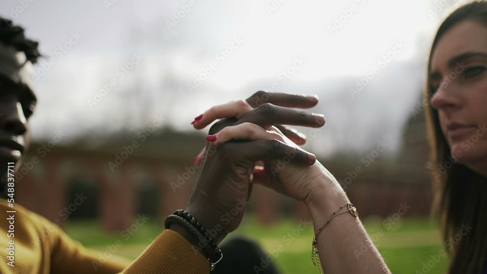 Black man and white woman hands uniting together, diversity concept ...