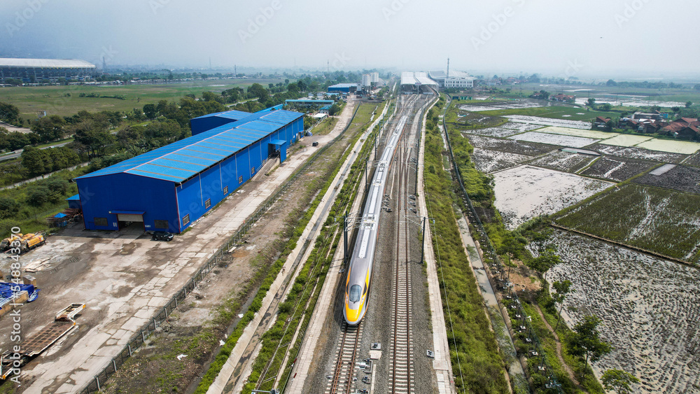 Aerial view of the High speed orange train on the railway station. High ...