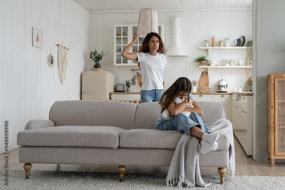 Frustrated parent mother showing anger to child daughter, scolding ...