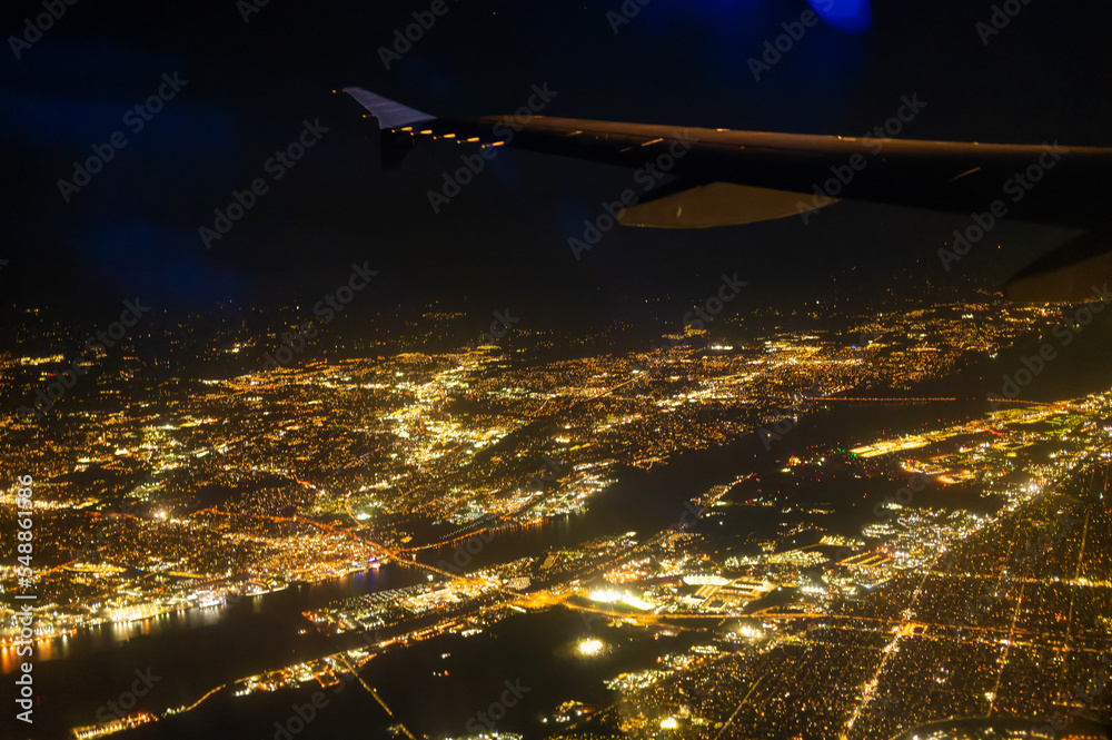 Fantastic view of the night city from a bird's eye view. The city is ...