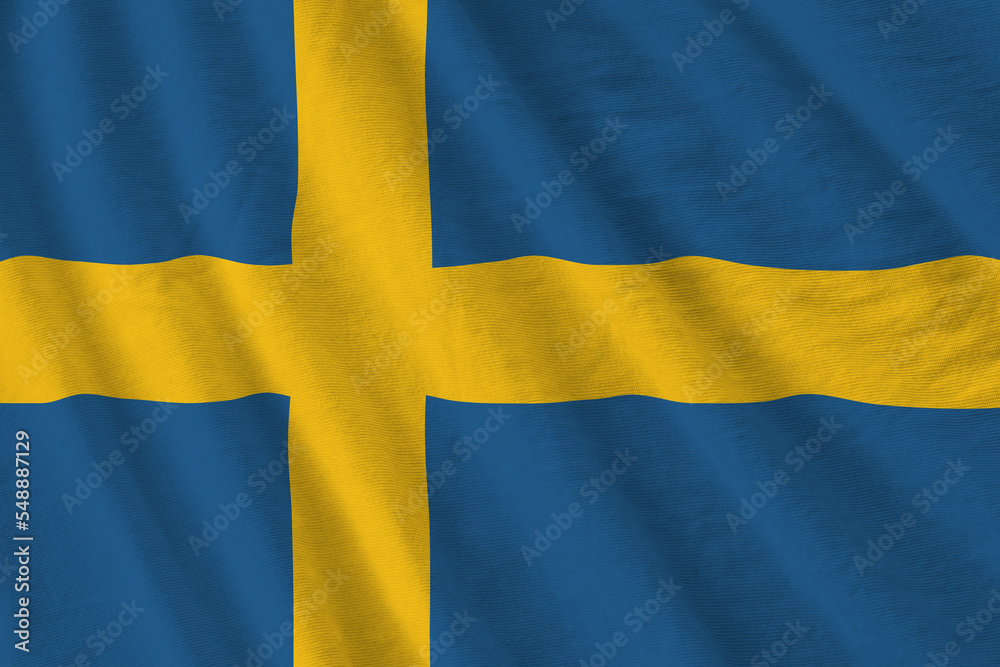 Sweden flag with big folds waving close up under the studio light ...