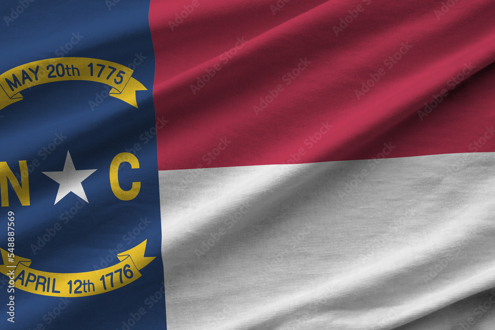 North Carolina US state flag with big folds waving close up under the ...