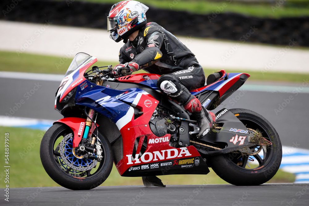 Tetsuta NAGASHIMA of Japan on the Team HRC Honda's is seen dragging his ...