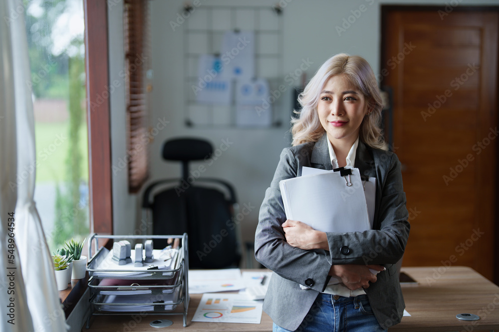 Portrait of a woman business owner showing a happy smiling face as he ...