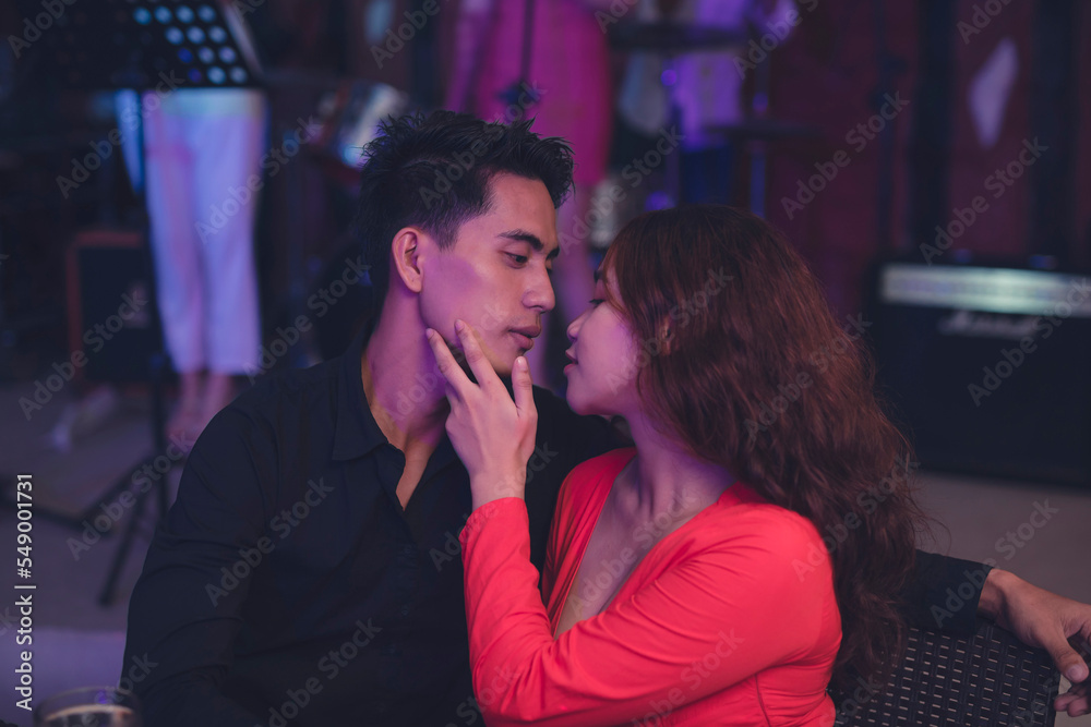 The lovely couple draws their lips close to each other in an attempt a ...