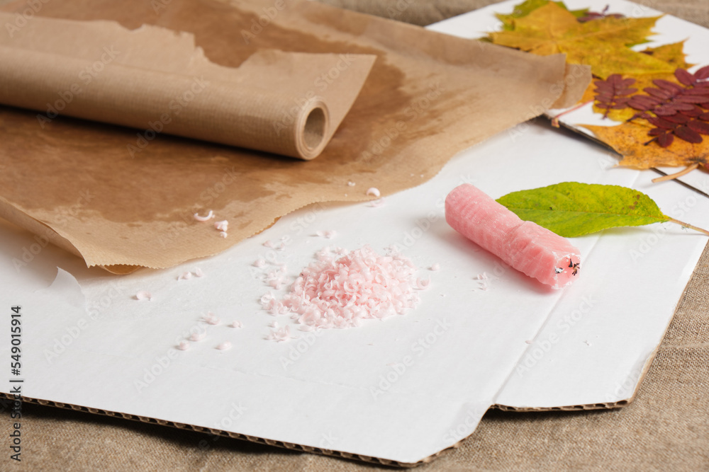 the process of coating leaves with paraffin using wax paper Stock Photo ...