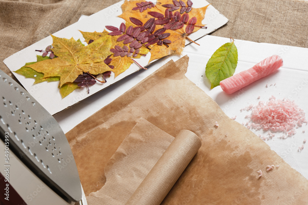 the process of coating leaves with paraffin using wax paper Stock Photo ...