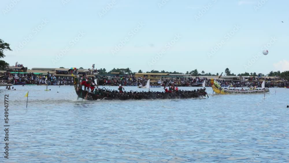 Snake Boat races of Kerala. People in traditional dress rowing the ...