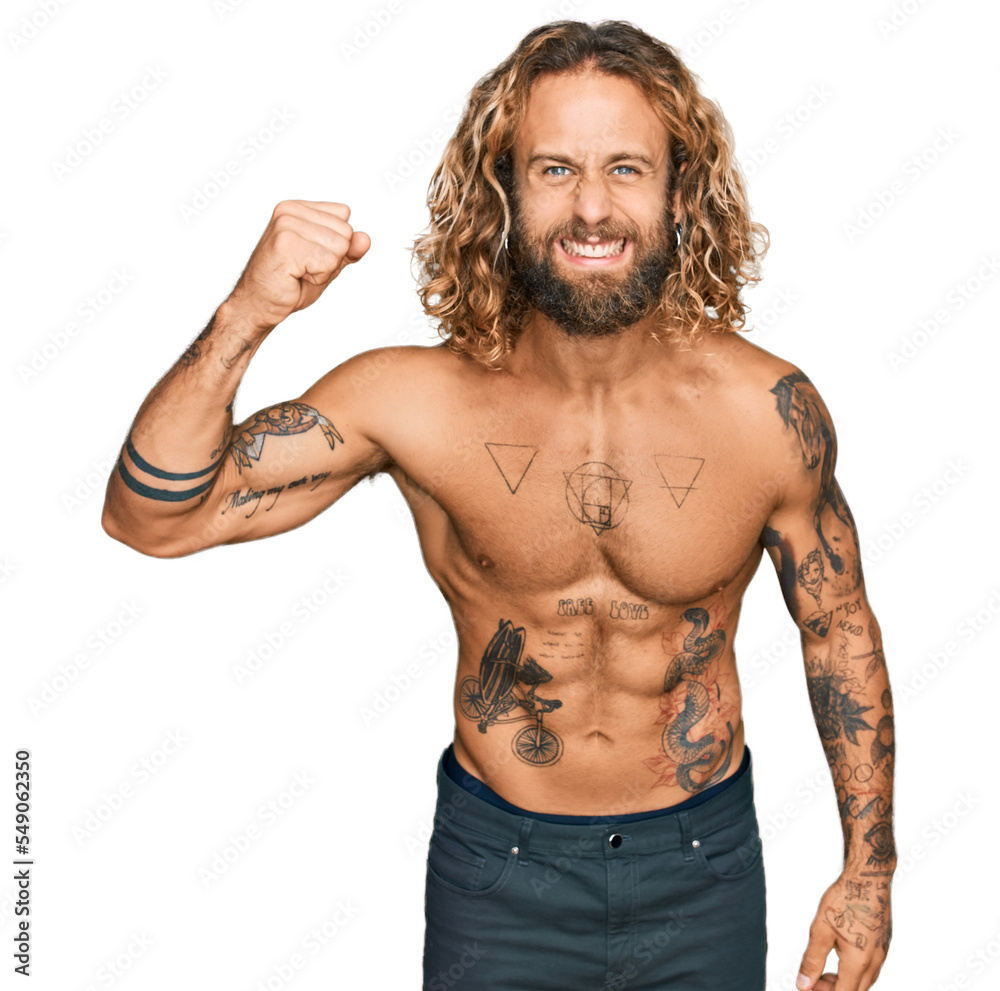 Foto de Handsome man with beard and long hair standing shirtless ...