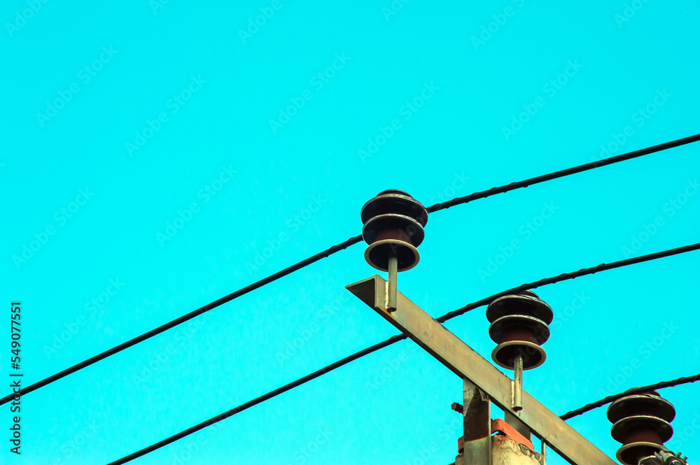 Power electric pole with line wire on colored background close up ...