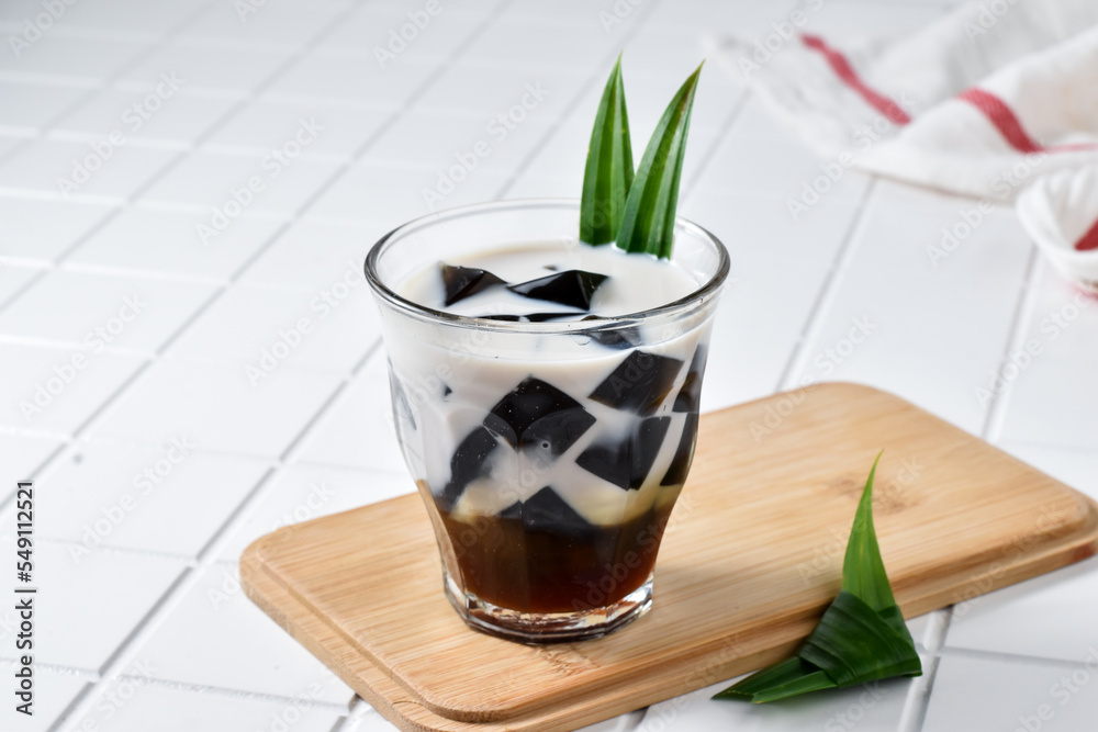 Summer drink Es Cincau Hitam, made from black grass jelly with coconut ...