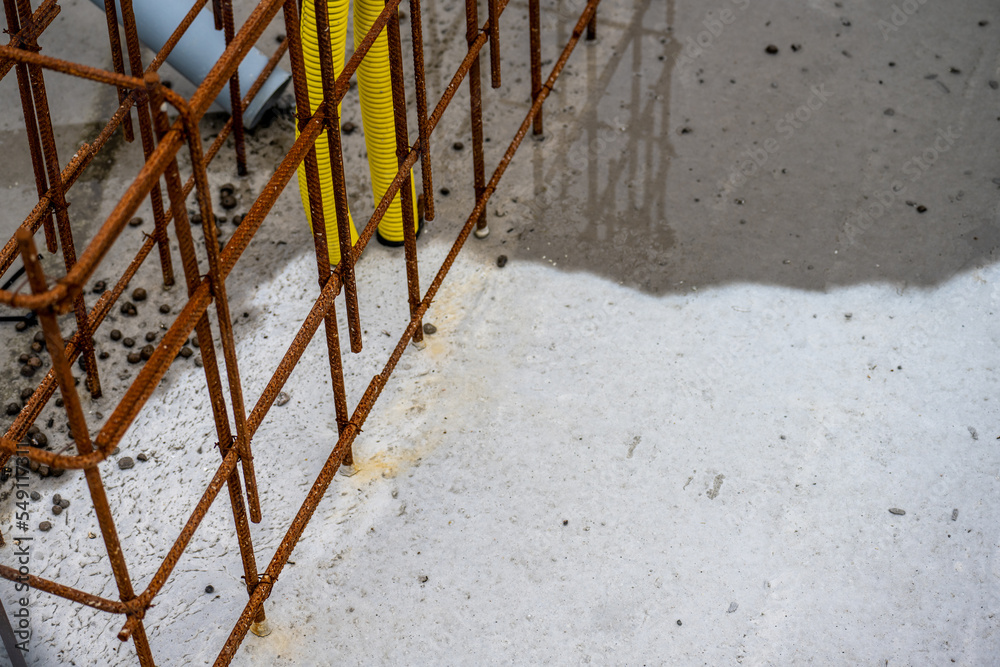 Rebar in concrete at a construction site. Stock Photo | Adobe Stock