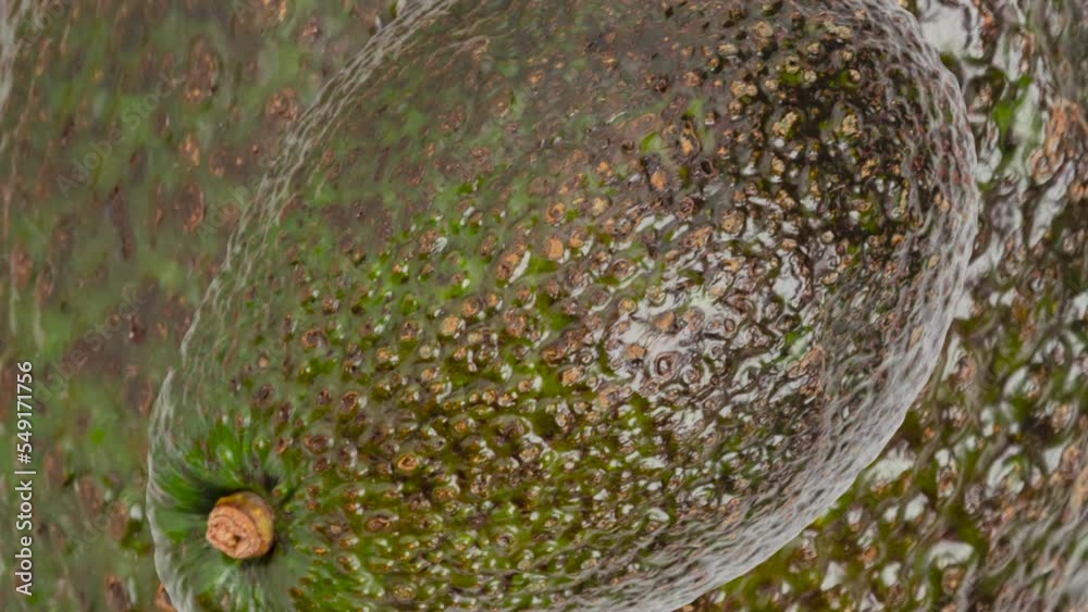 Zooming Avocado in seamless loop background. Exotic fruits in seamless ...